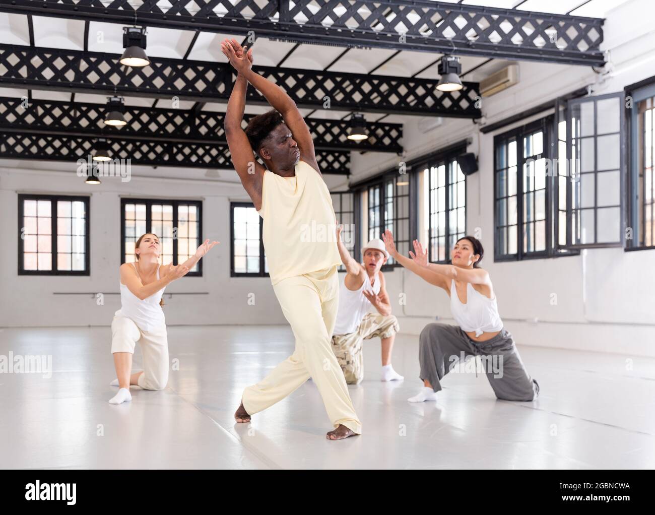 Group of artists rehearsing spectacle scene Stock Photo - Alamy