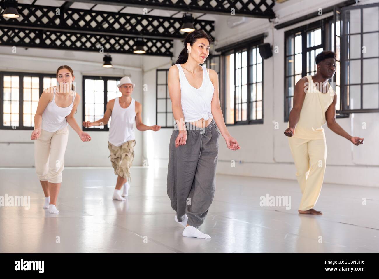 People practicing vigorous lindy hop movements in dance class Stock ...