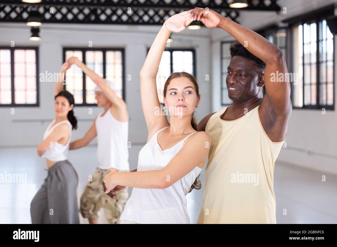 Dancing couples enjoying salsa hi-res stock photography and images - Alamy