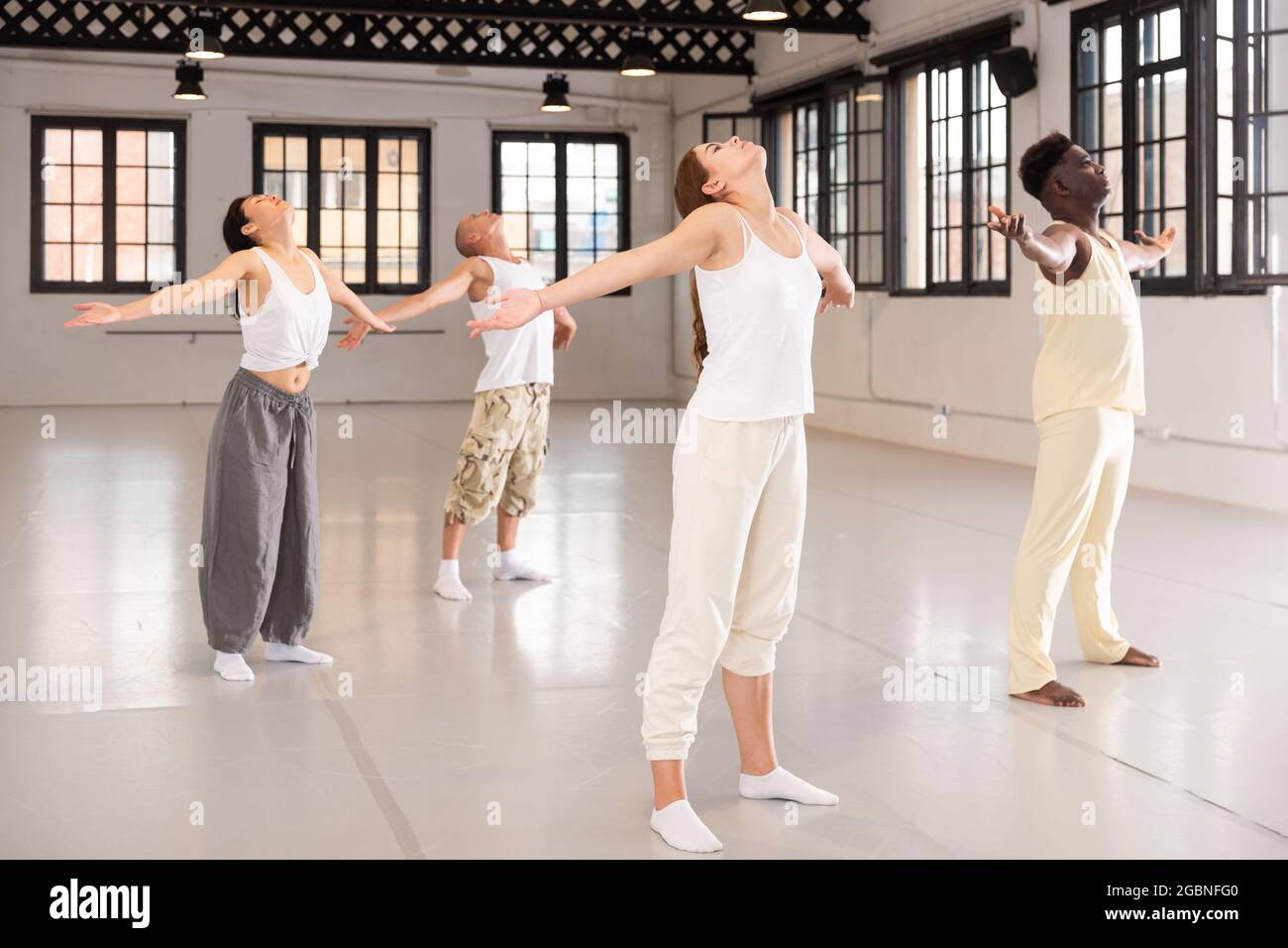Group of people performing relaxing dance Stock Photo - Alamy