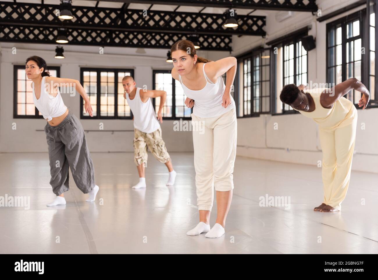 Group of young people learning modern dance movements Stock Photo - Alamy