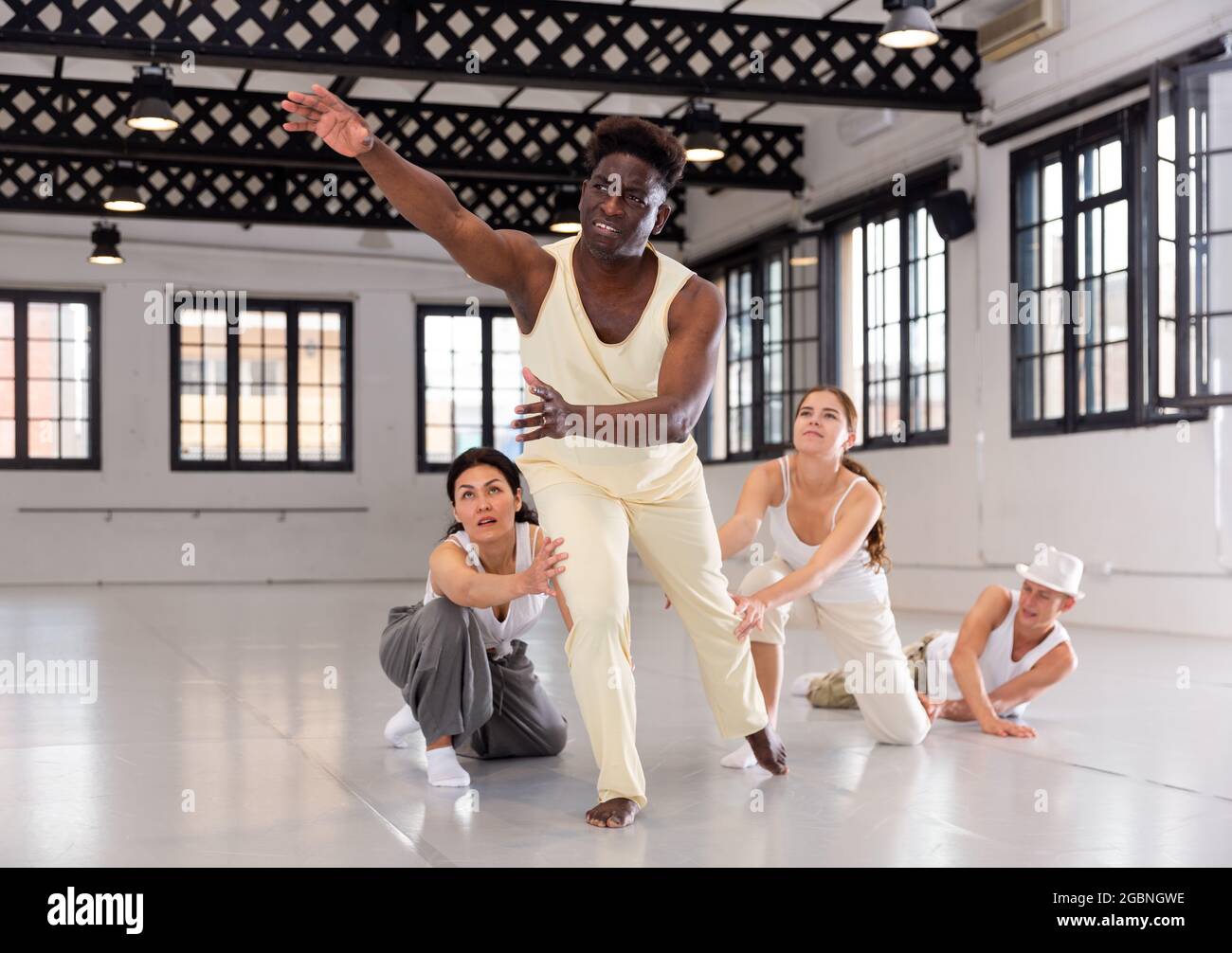 Dancers is doing exercises in class Stock Photo - Alamy