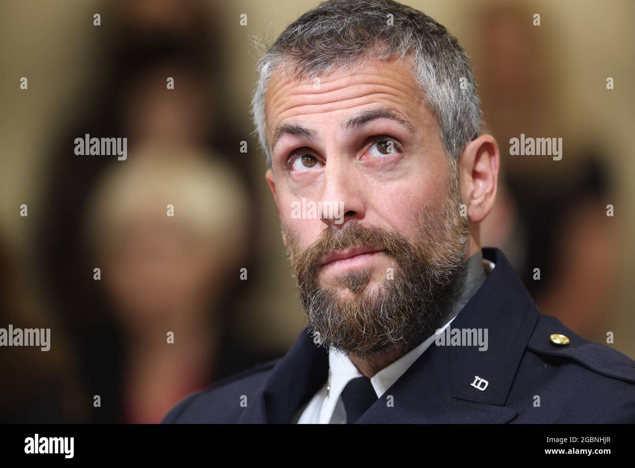 DC Metropolitan Police Department Officer Michael Fanone watches as a ...