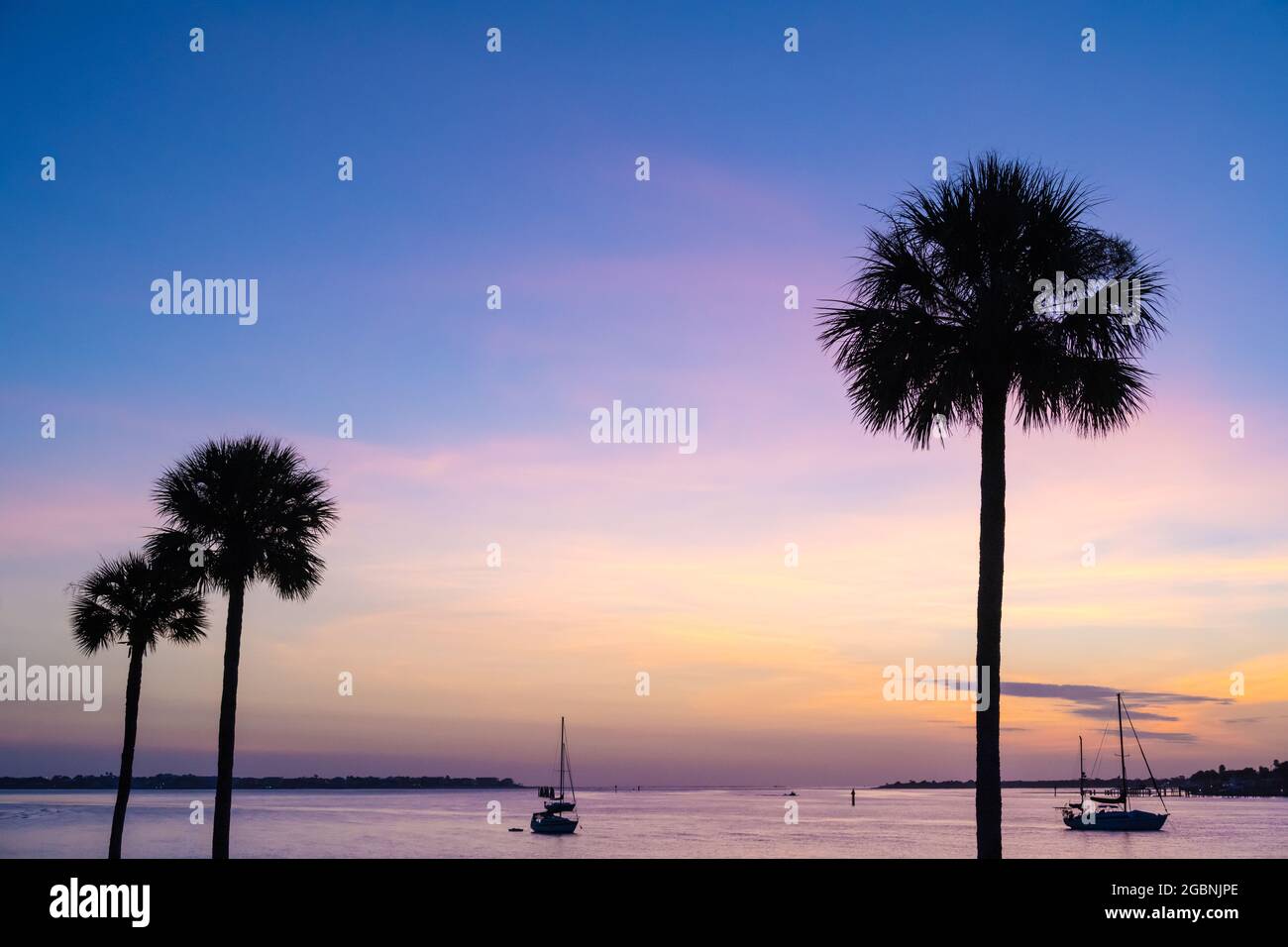 Colorful sunrise with sailboats harboring in Matanzas Bay as viewed ...