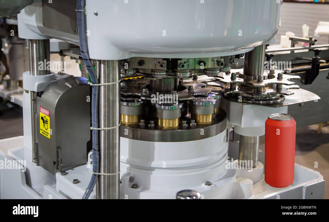 High speed can seamer machine. Tin can sealing machinery. Food industry ...