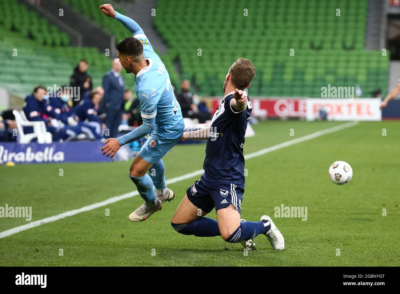 Marco Tilio of Melbourne City and Nick Ansell of Melbourne Victory go ...