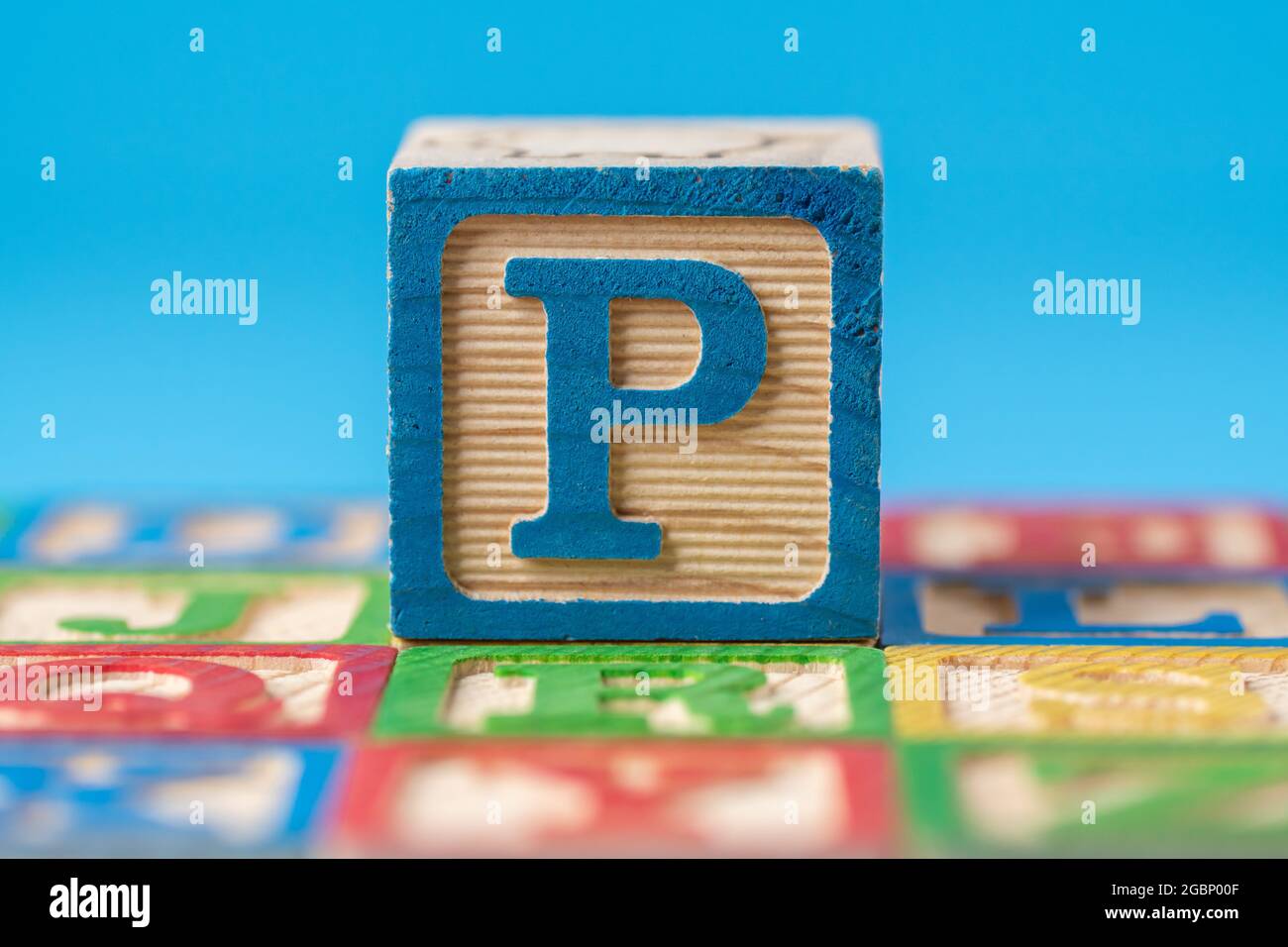 Letter "P" of education alphabet ABC wooden block Stock Photo - Alamy