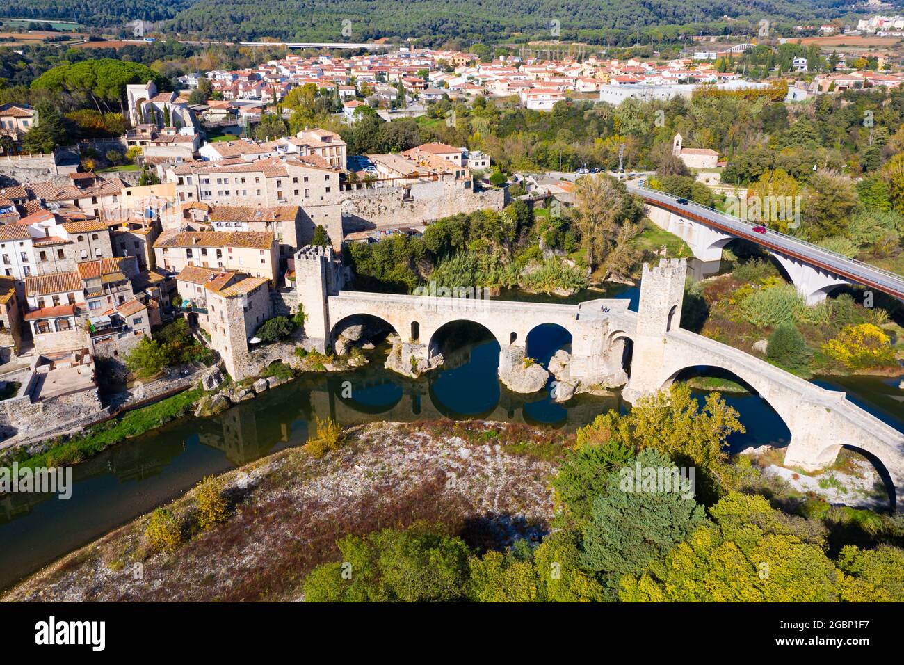 View from drone of Besalu with arched bridge over Fluvia river Stock ...