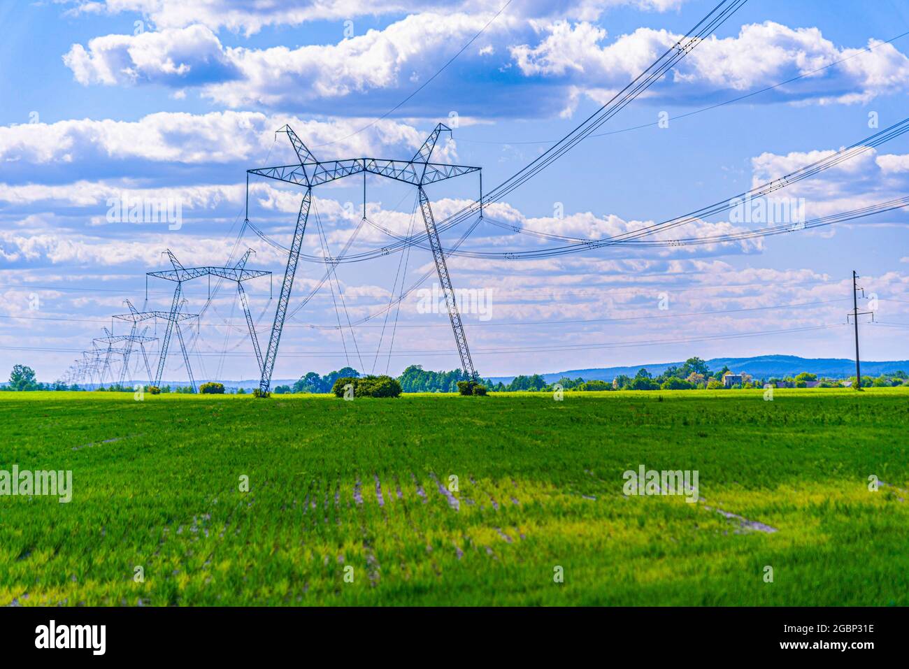 A view of Power lines, electric power transmissions at a field in ...