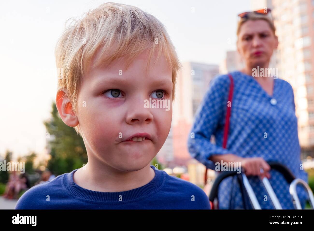 the mother looks reproachfully at the guilty boy.the concept of child ...
