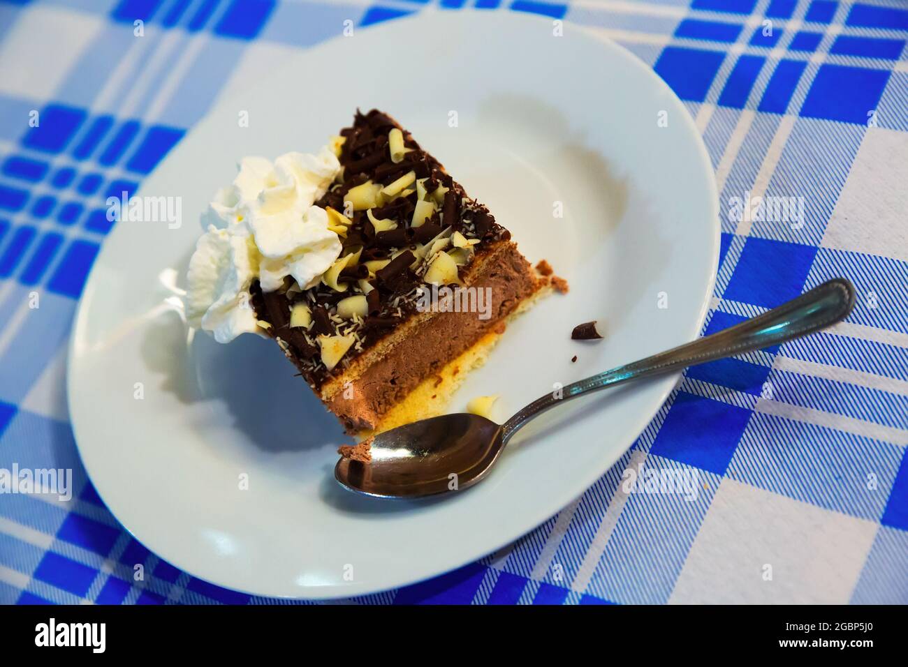 Slice of soft biscuit cake with cream and chocolate Stock Photo - Alamy