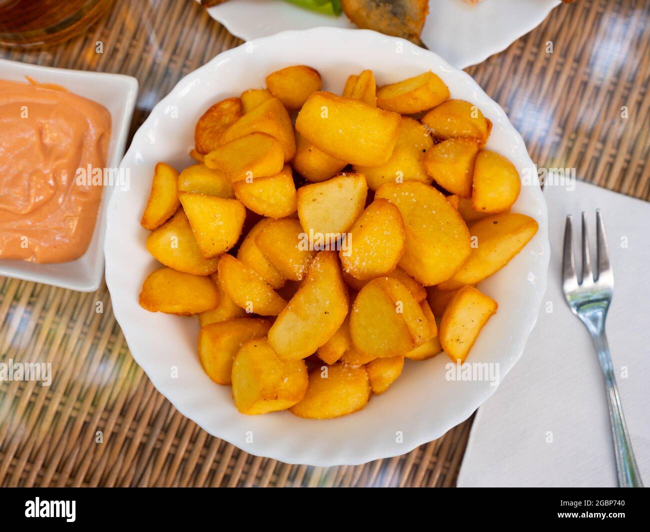 Spanish fried potatoes patatas bravas Stock Photo - Alamy
