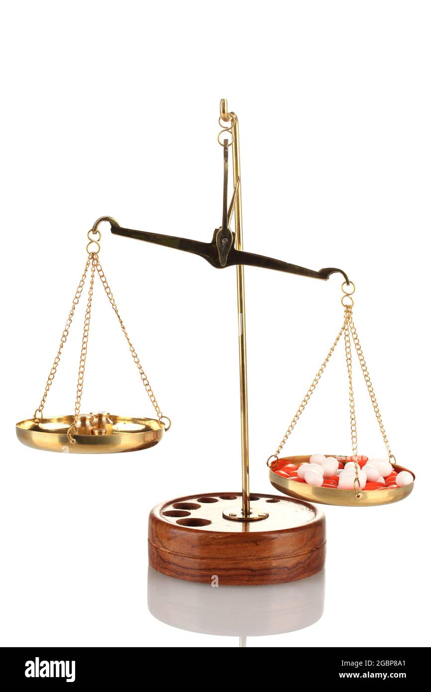Classic scales with color pills isolated on white Stock Photo - Alamy