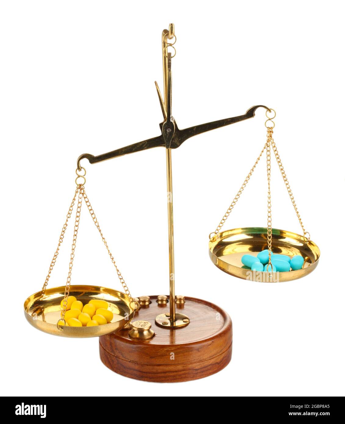 Classic scales with color pills isolated on white Stock Photo - Alamy