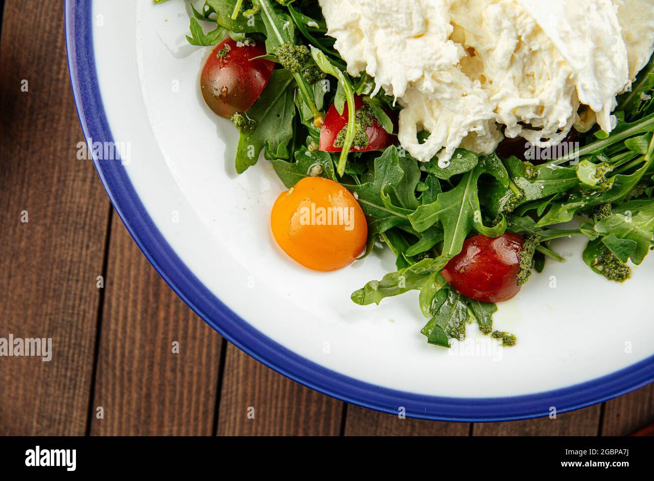 Burrata cheese arugula salad Stock Photo - Alamy