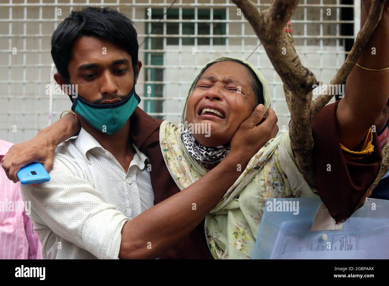 Relatives of victims at the DMCH morgue area, crying After to obtain ...