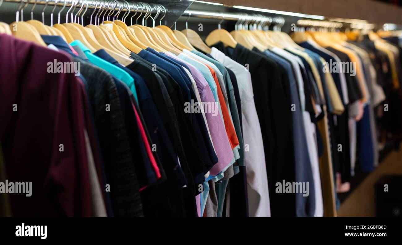 Men clothes in modern garments shop Stock Photo - Alamy