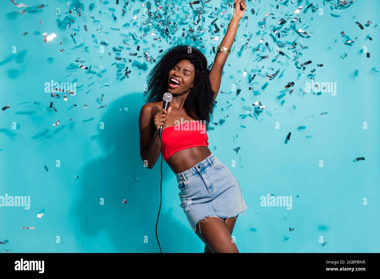Photo of sweet charming dark skin lady pointing singing karaoke closed ...