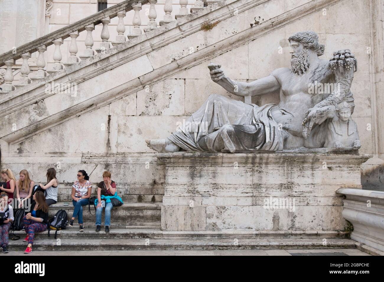 A monumental sculpture near exterior stairs in the piazza in front of ...