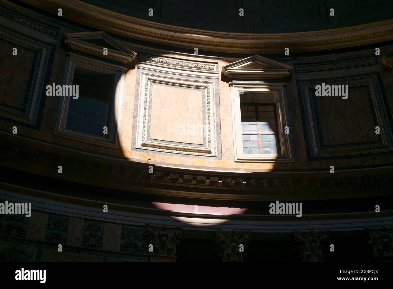 Light from the oculus at the Pantheon shining on one of the interior ...