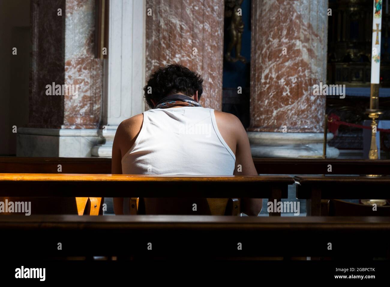 Divine, golden light streams through a window and shines on a ...