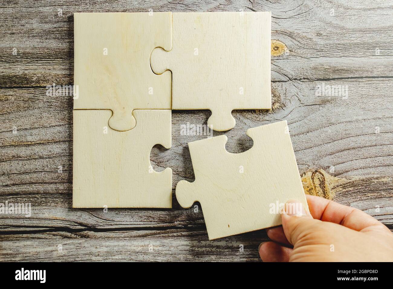 White jigsaw puzzle connecting together. Team business success ...