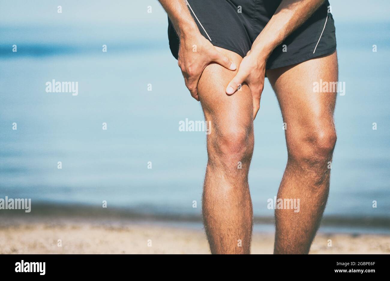 Sports injury muscle cramp pain fit runner man athlete holding painful ...