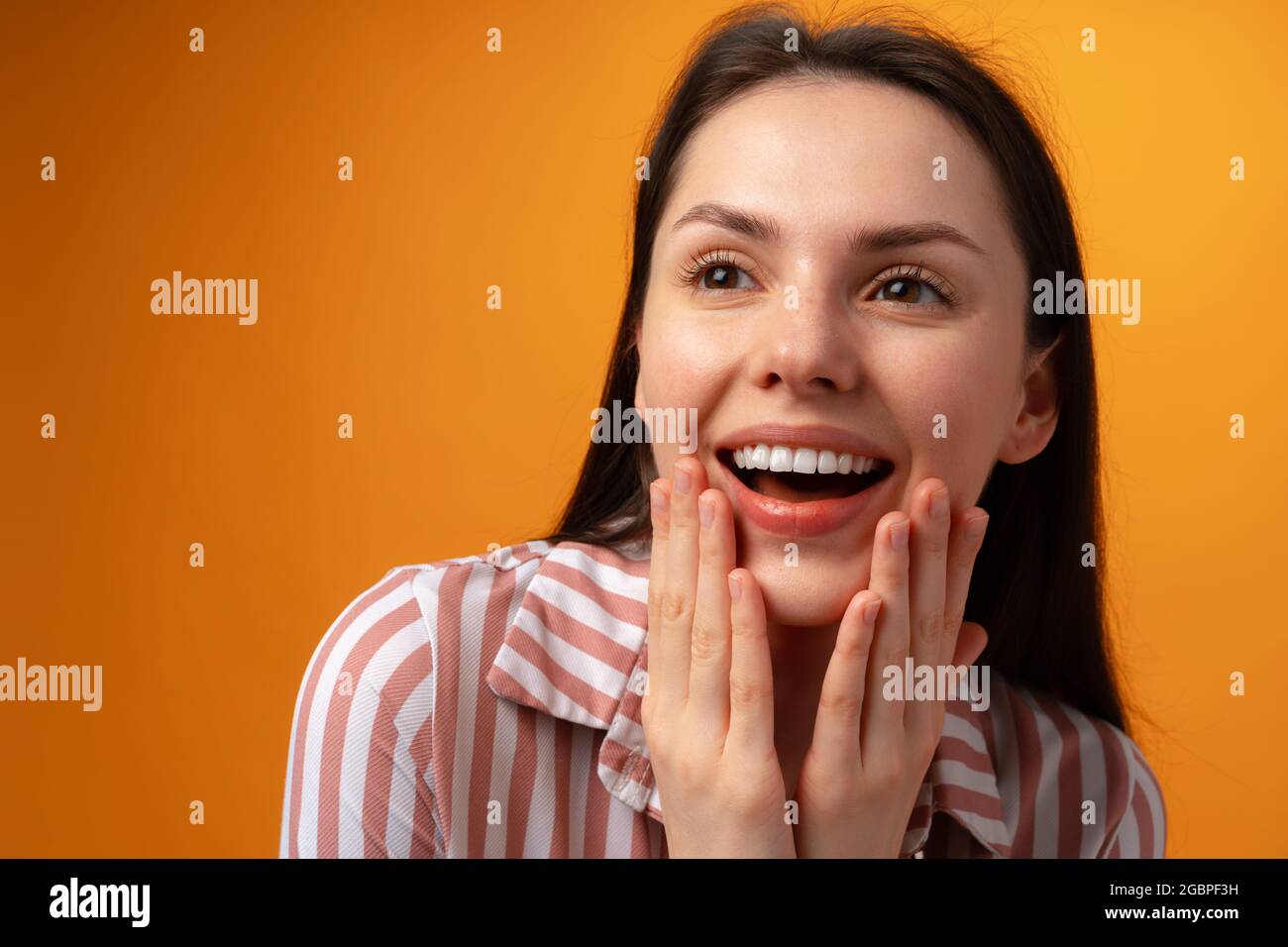 Shocked and surprised girl screaming against pink background Stock ...