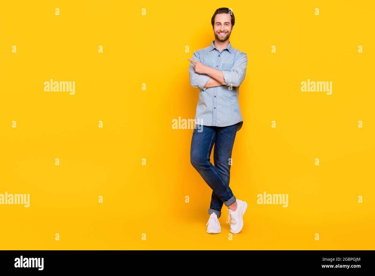 Full body photo of young cheerful man happy positive smile point finger ...