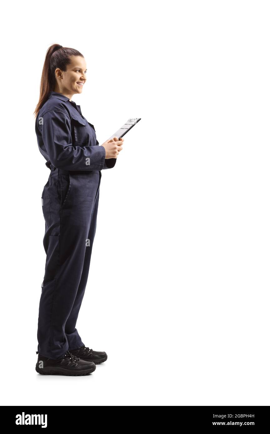 Full length profile shot of a female auto mechanic worker standing and ...