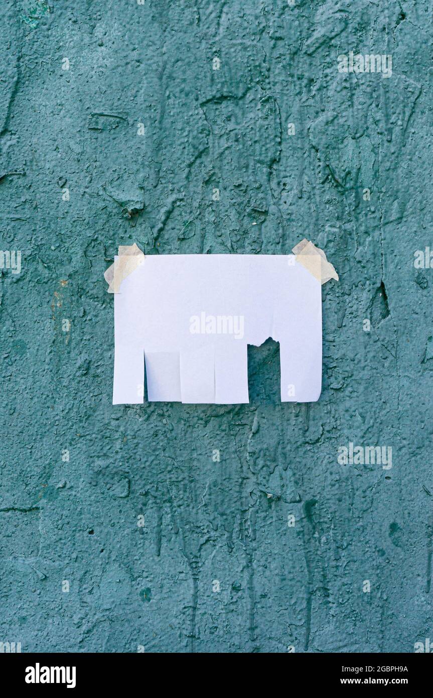 Tear off paper on paint wall. Mock up template. Street paper ad or ...