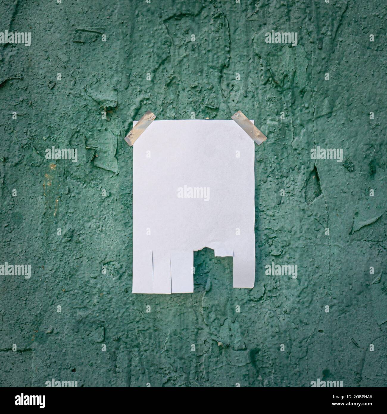 Tear off paper on paint wall. Mock up template. Street paper ad or ...