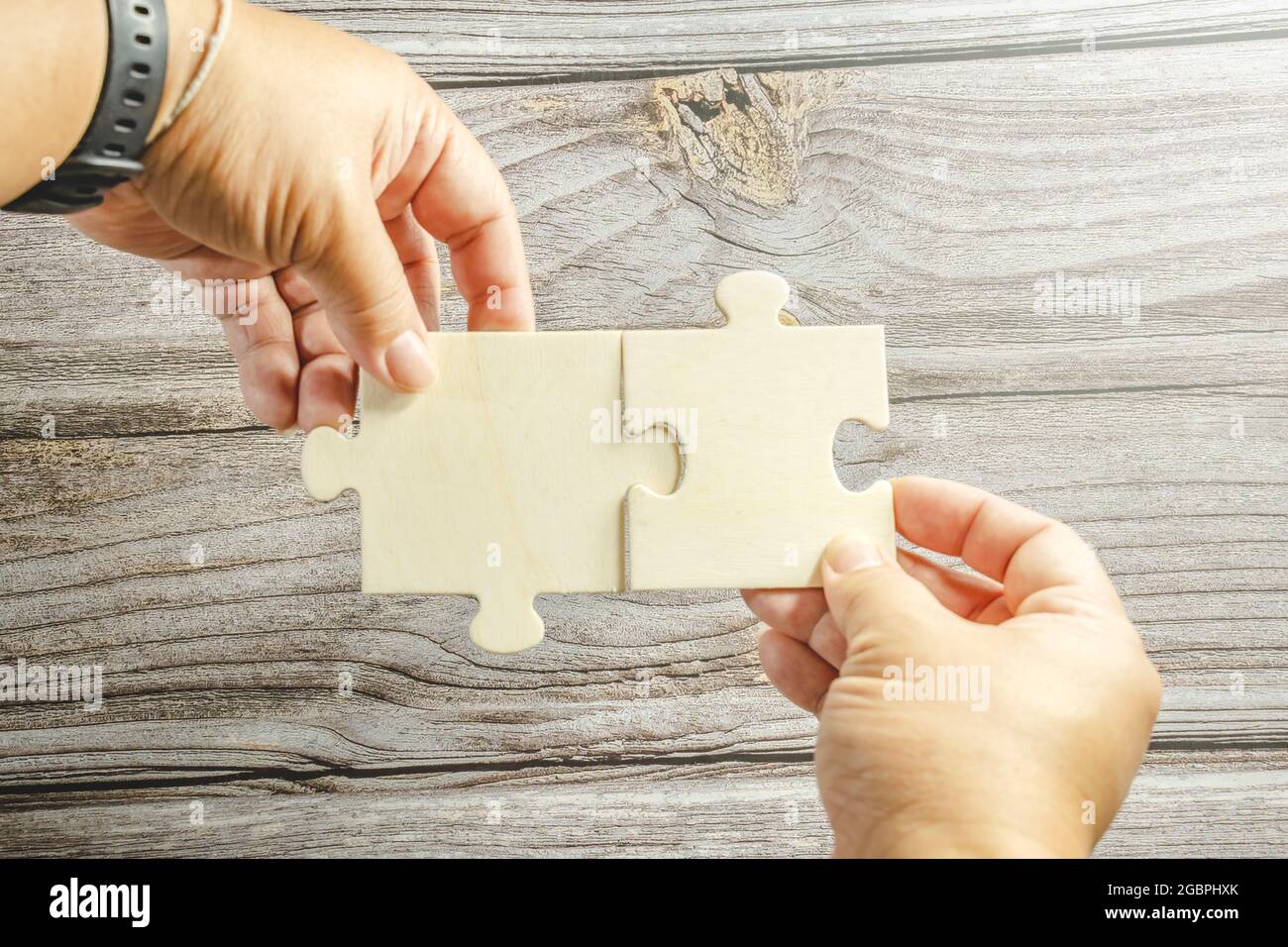 White jigsaw puzzle connecting together. Team business success ...