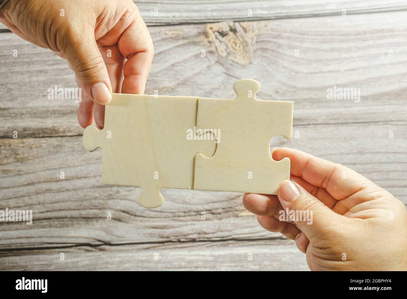 White jigsaw puzzle connecting together. Team business success ...