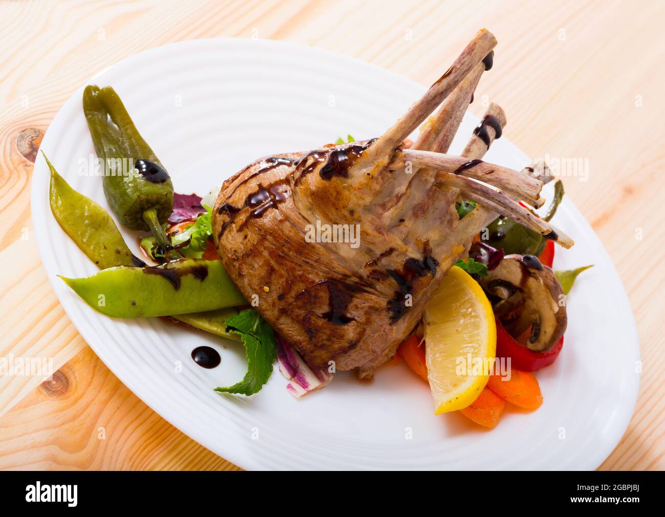 Roasted rack of mutton with vegetables Stock Photo - Alamy