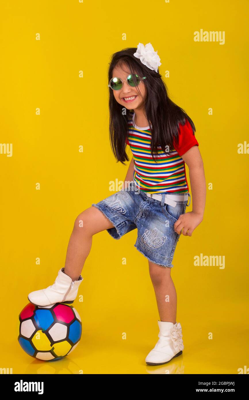 Indian happy kid with ball hi-res stock photography and images - Alamy