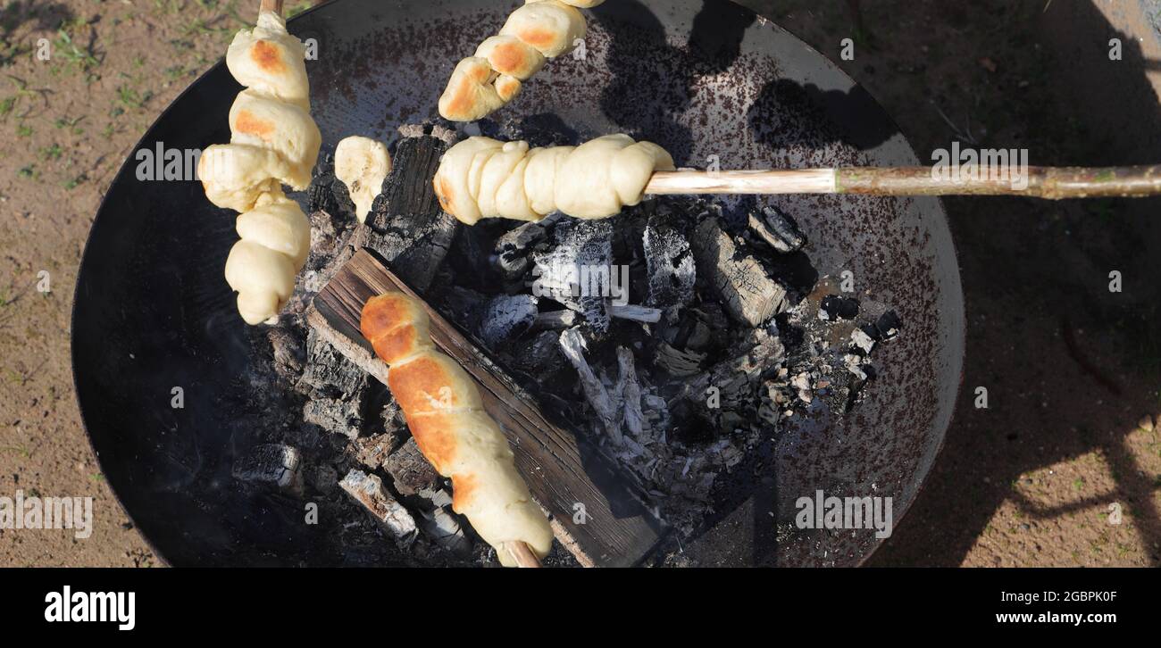 Making bread at the campfire Stock Photo - Alamy