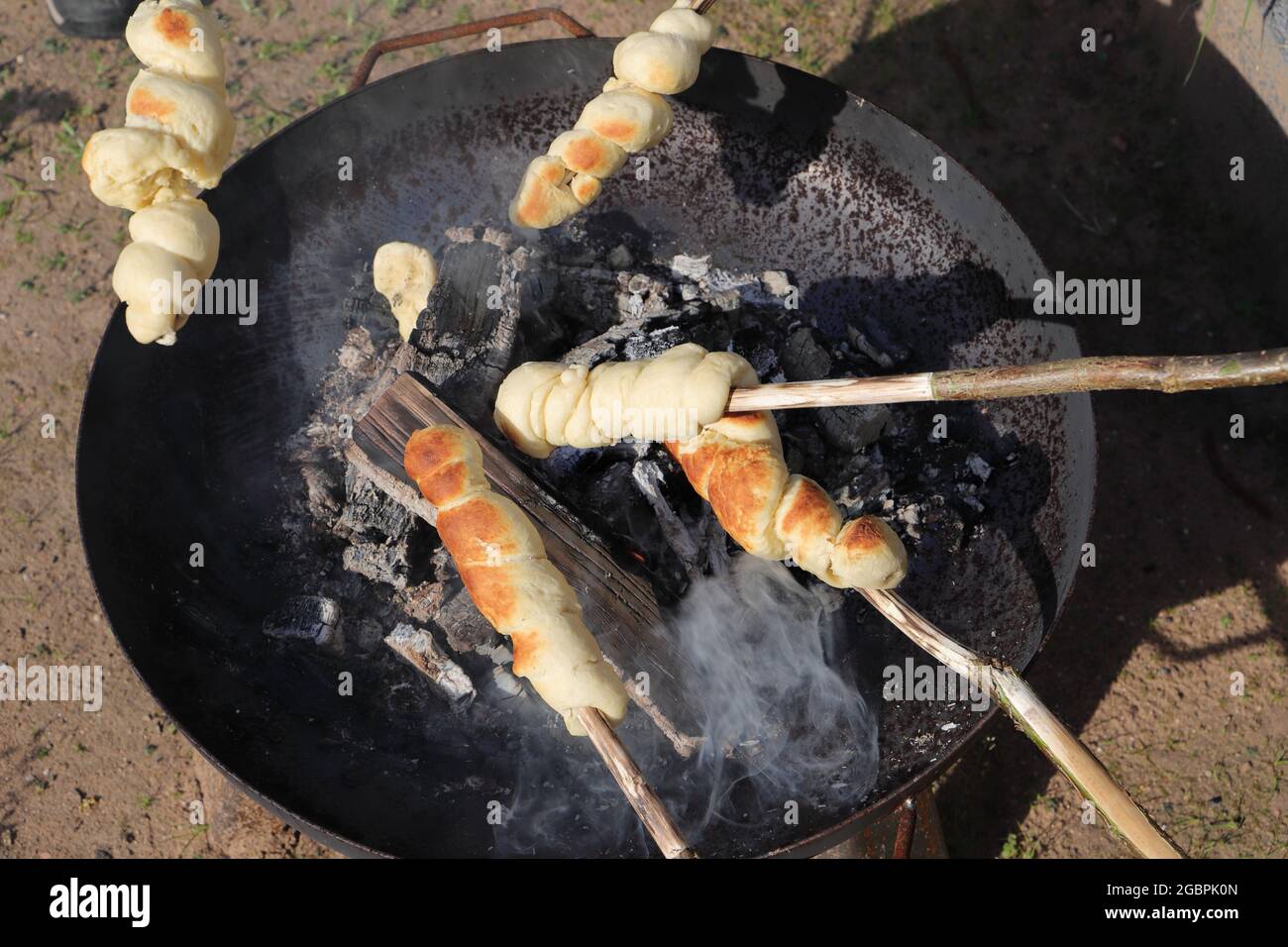 Making bread at the campfire Stock Photo - Alamy