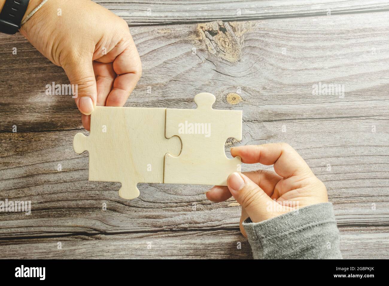 White jigsaw puzzle connecting together. Team business success ...