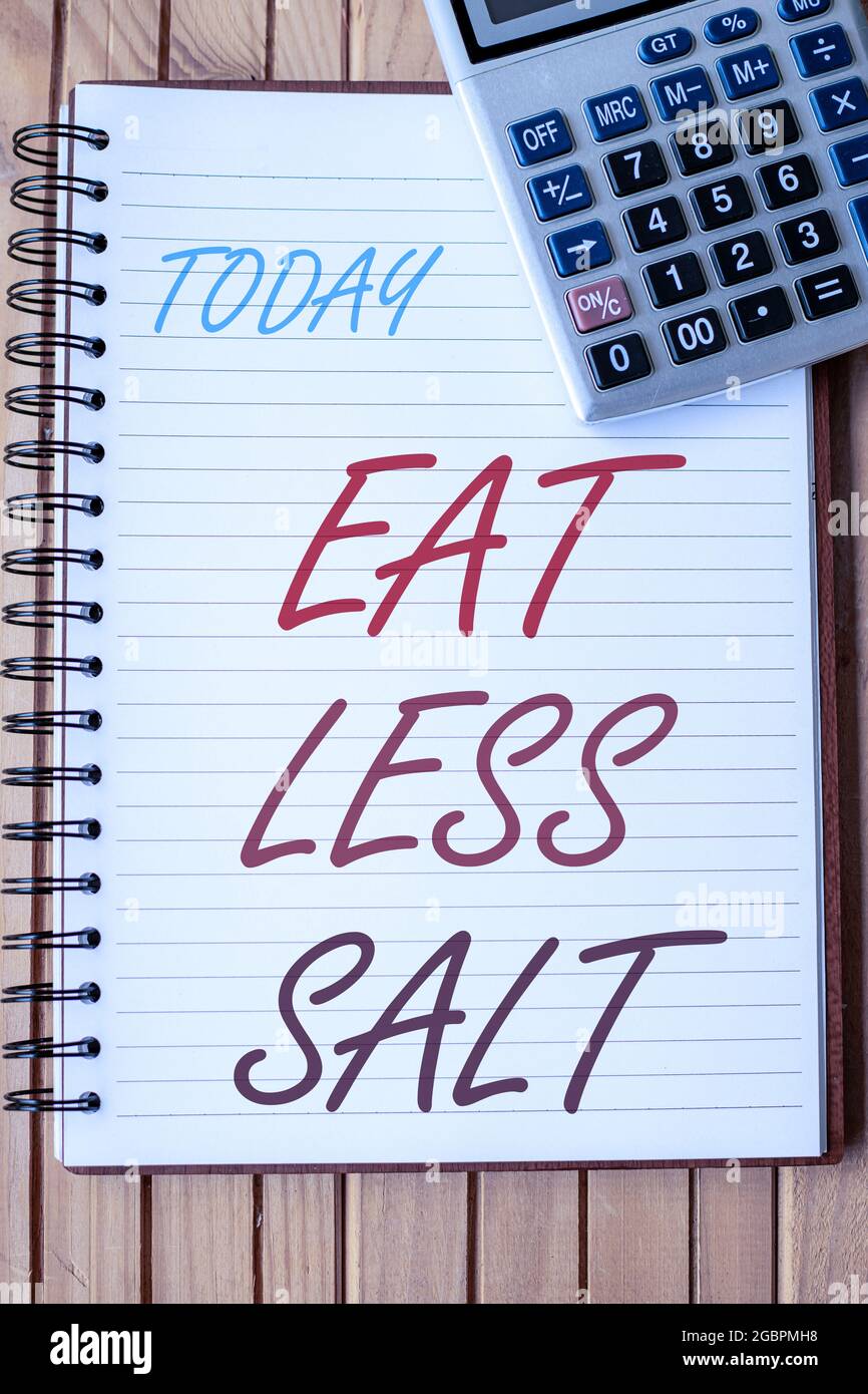 Text sign showing Eat Less Salt. Internet Concept reducing the sodium ...