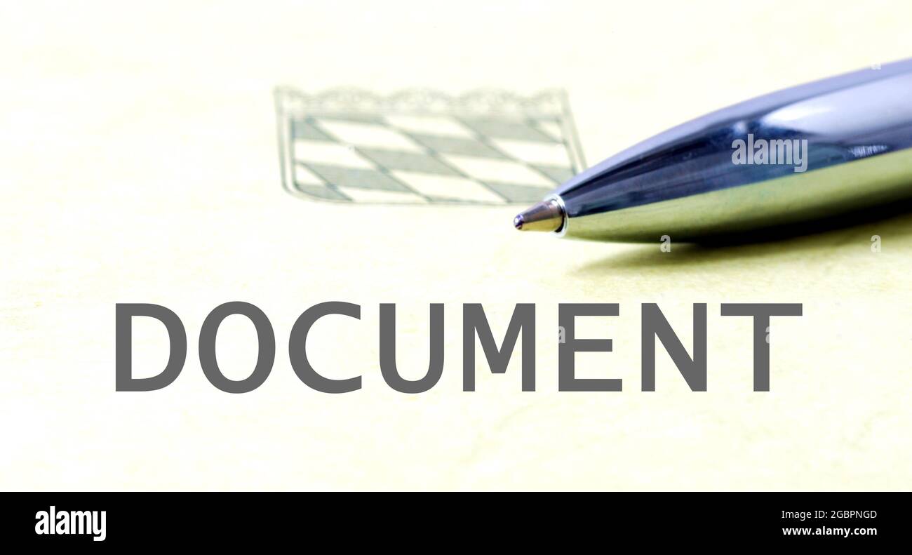 Document with silver ballpoint pen Stock Photo - Alamy