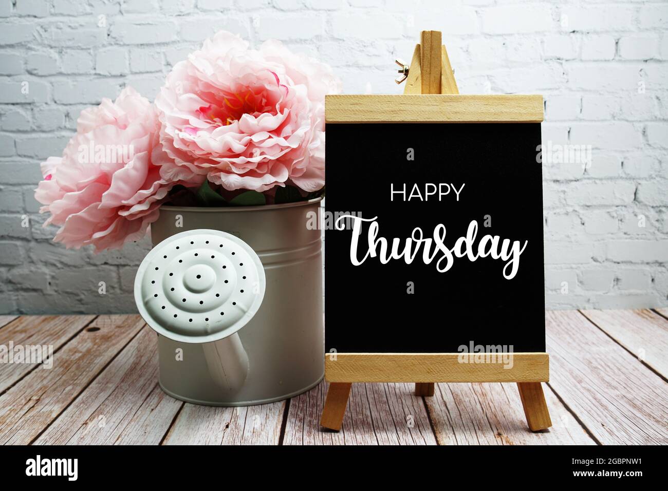 Happy Thursday typography text on easel wooden board Stock Photo - Alamy