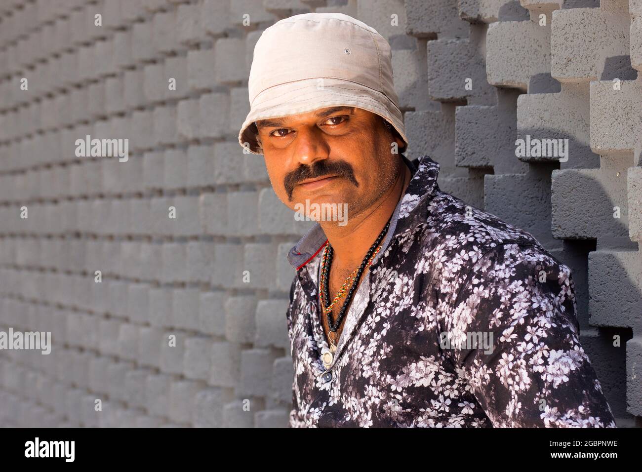 Young Indian man with white cap Stock Photo - Alamy
