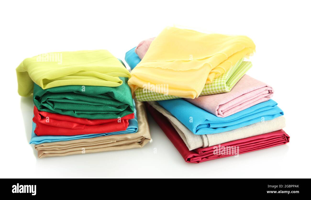 heap of cloth fabrics isolated on white Stock Photo - Alamy
