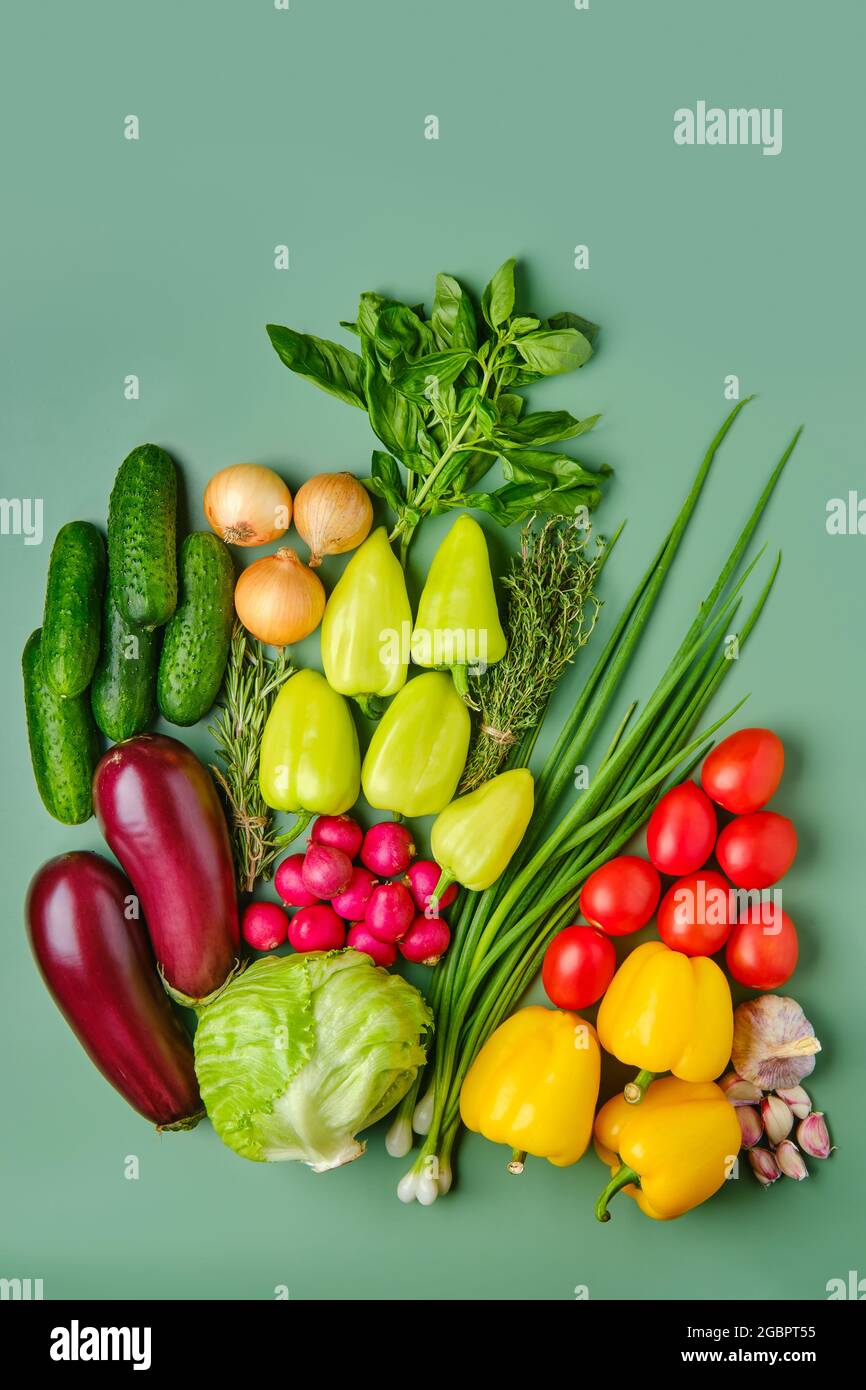 Fresh vegetables scattered on pale green background Stock Photo - Alamy