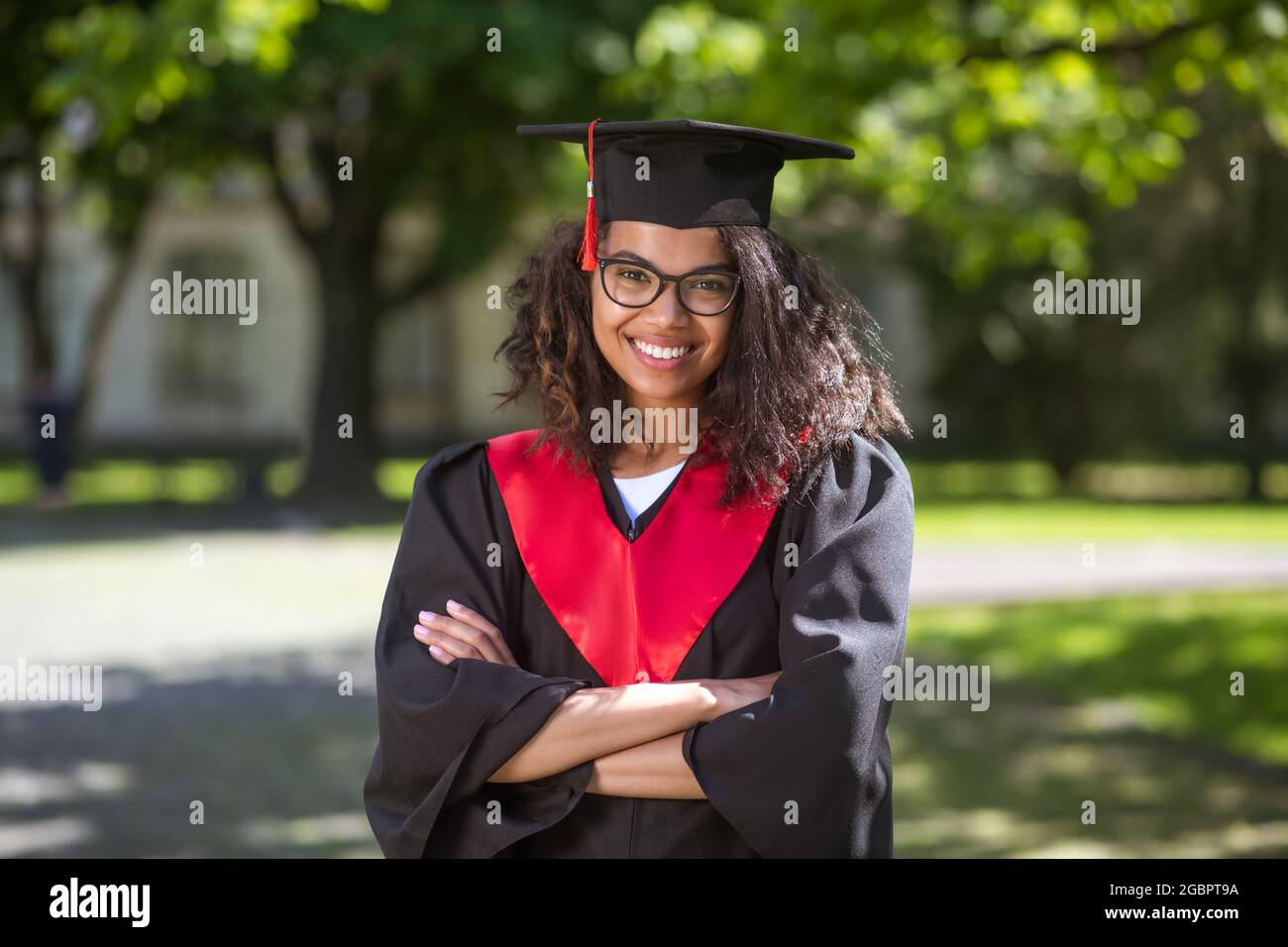 Pretty young girl in academic cap feeling happy about graduation Stock ...