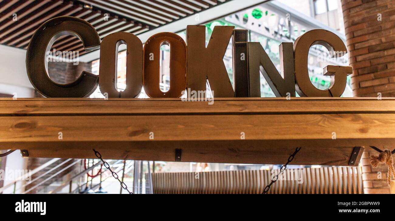 Wooden cooking letters over appetizers cart. Catering decoration ...