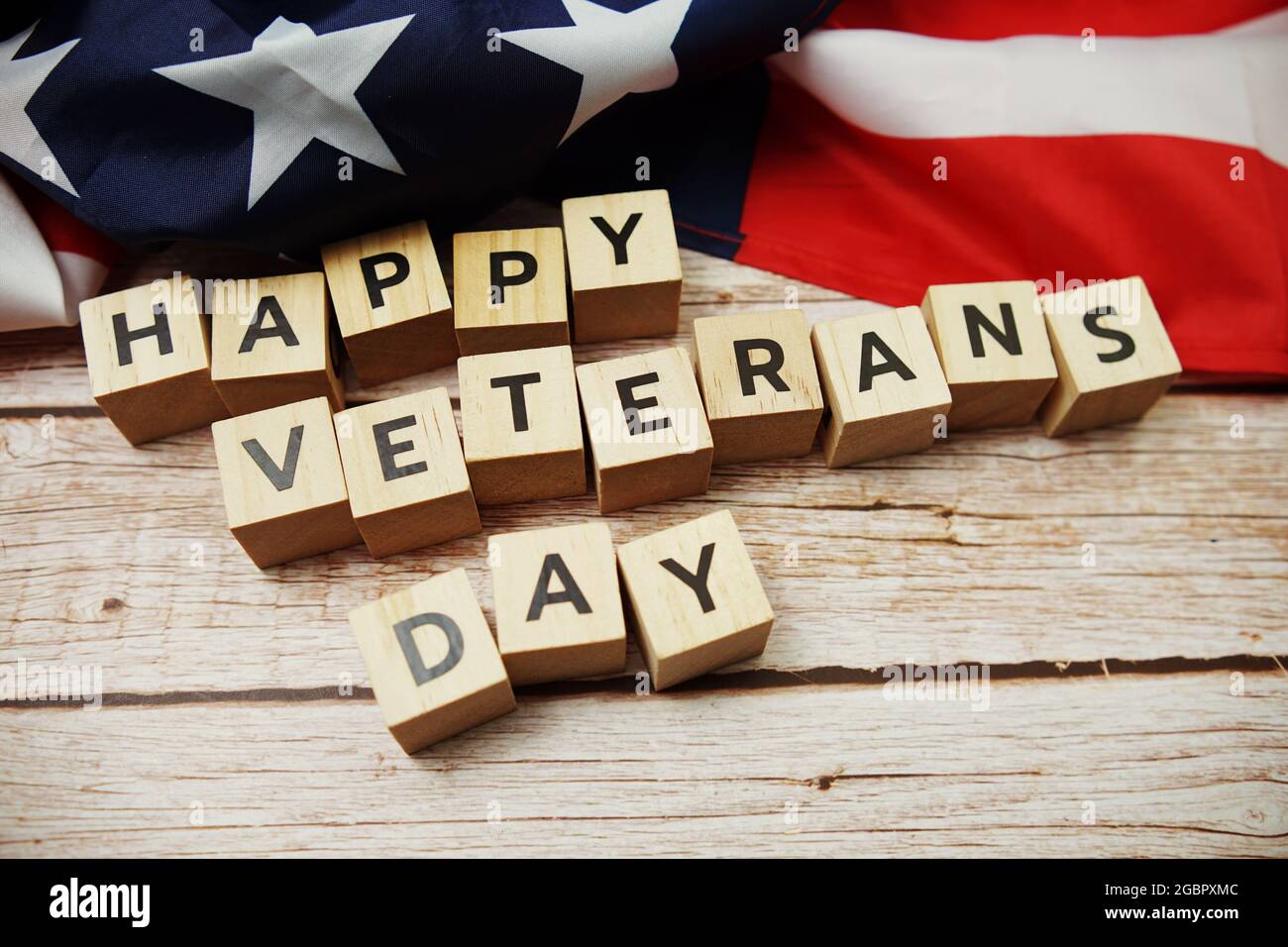 Happy Veterans Day alphabet letter and American flag on wooden ...