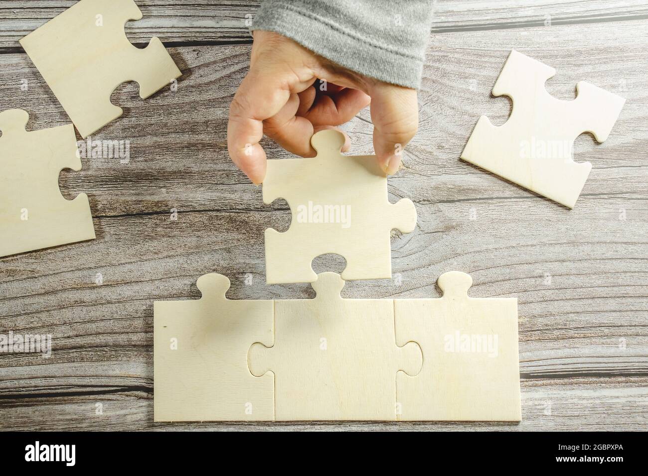 White jigsaw puzzle connecting together. Team business success ...