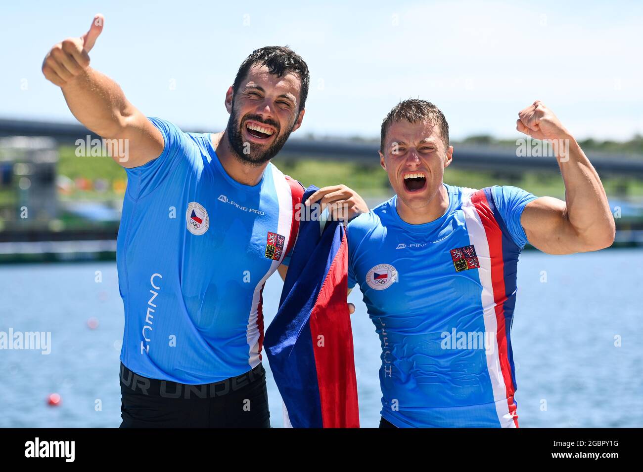 Czech sprint canoeists Josef Dostal, left, and Radek Slouf celebrate as ...